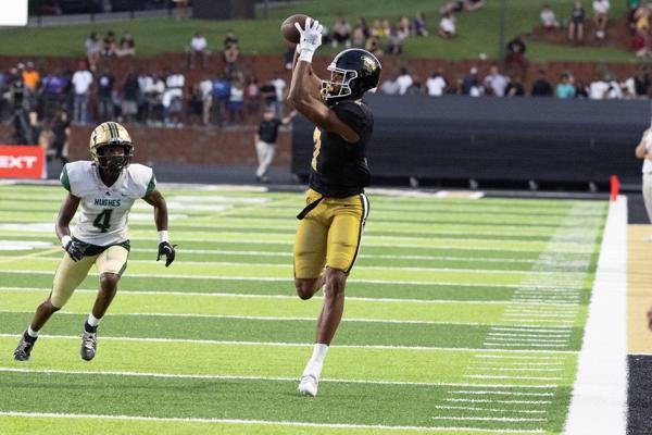 Trojans come up half-yard short against Hughes