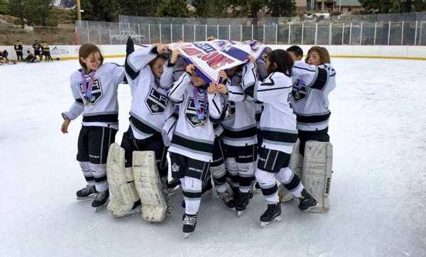 Squirt A2 squad celebrates Calder Classic title