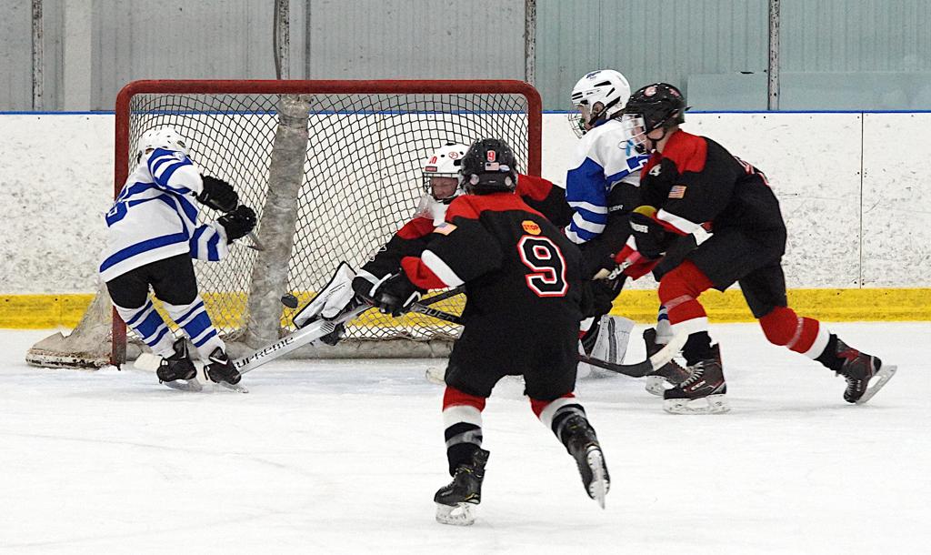 Jake Halvorson scores for Roseau in its 5-2 win over Rochester.