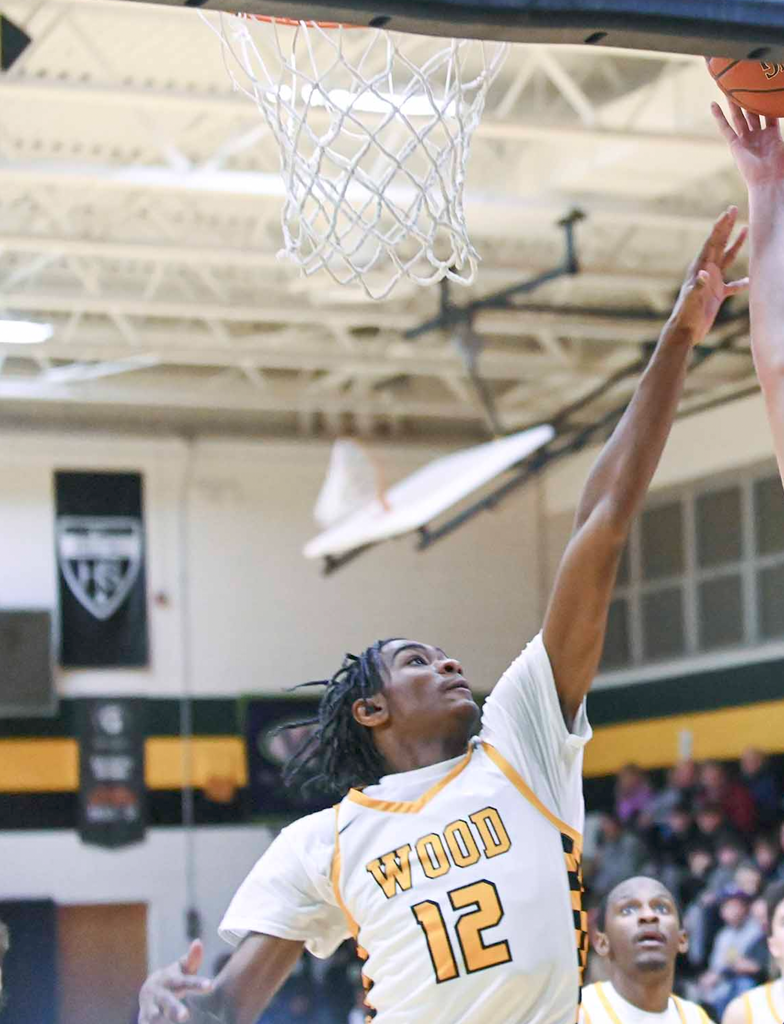 BOYS BASKETBALL: Reed and New Look Vikings Throttle Archbishop Carroll